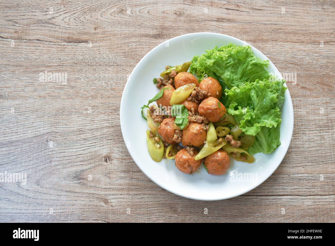 deep fried fish tofu ball with chop pork topping slice sweet green ...