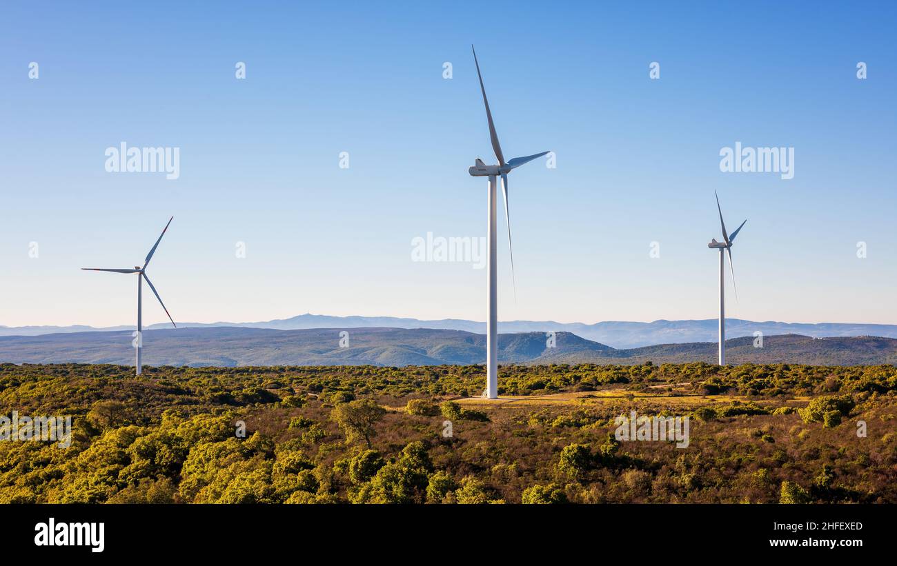 Wind turbines on a beautiful blue sky in a mountain wind farm in ...