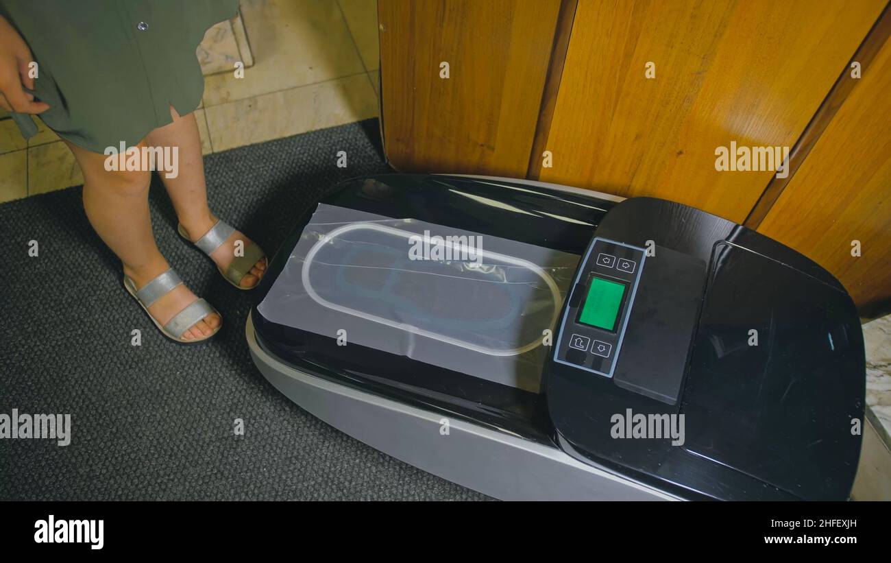Automatic Thermal Shrinkable Shoe Cover Laminating Machine. Close up ...