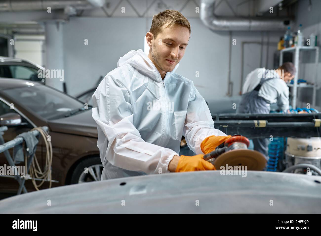 Car mechanic in workshop cleaning hi-res stock photography and images ...