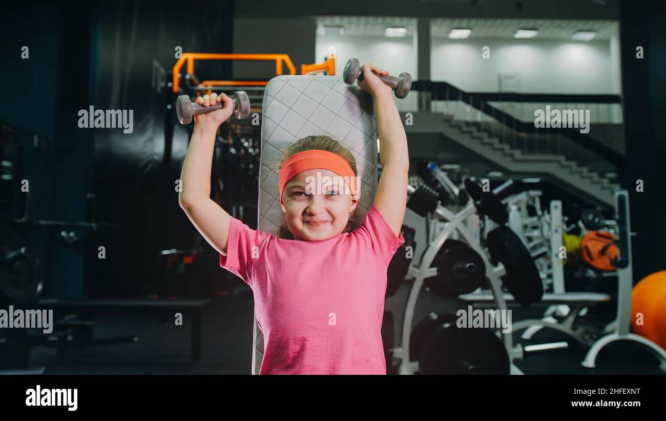 Fit Athletic Baby Girl Work out with Dumbbell, Doing Her Fitness ...