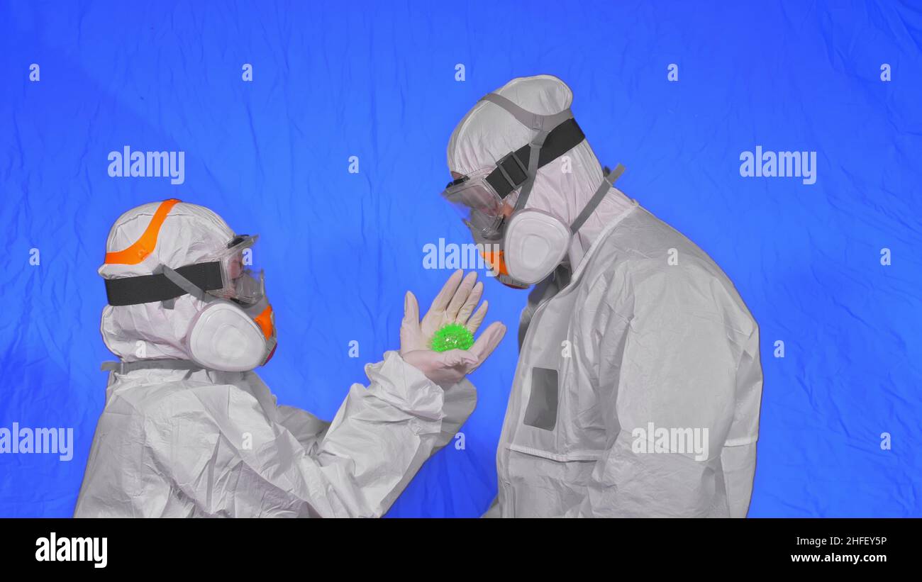 Doctor in respirator show a virus model concept health safety ...