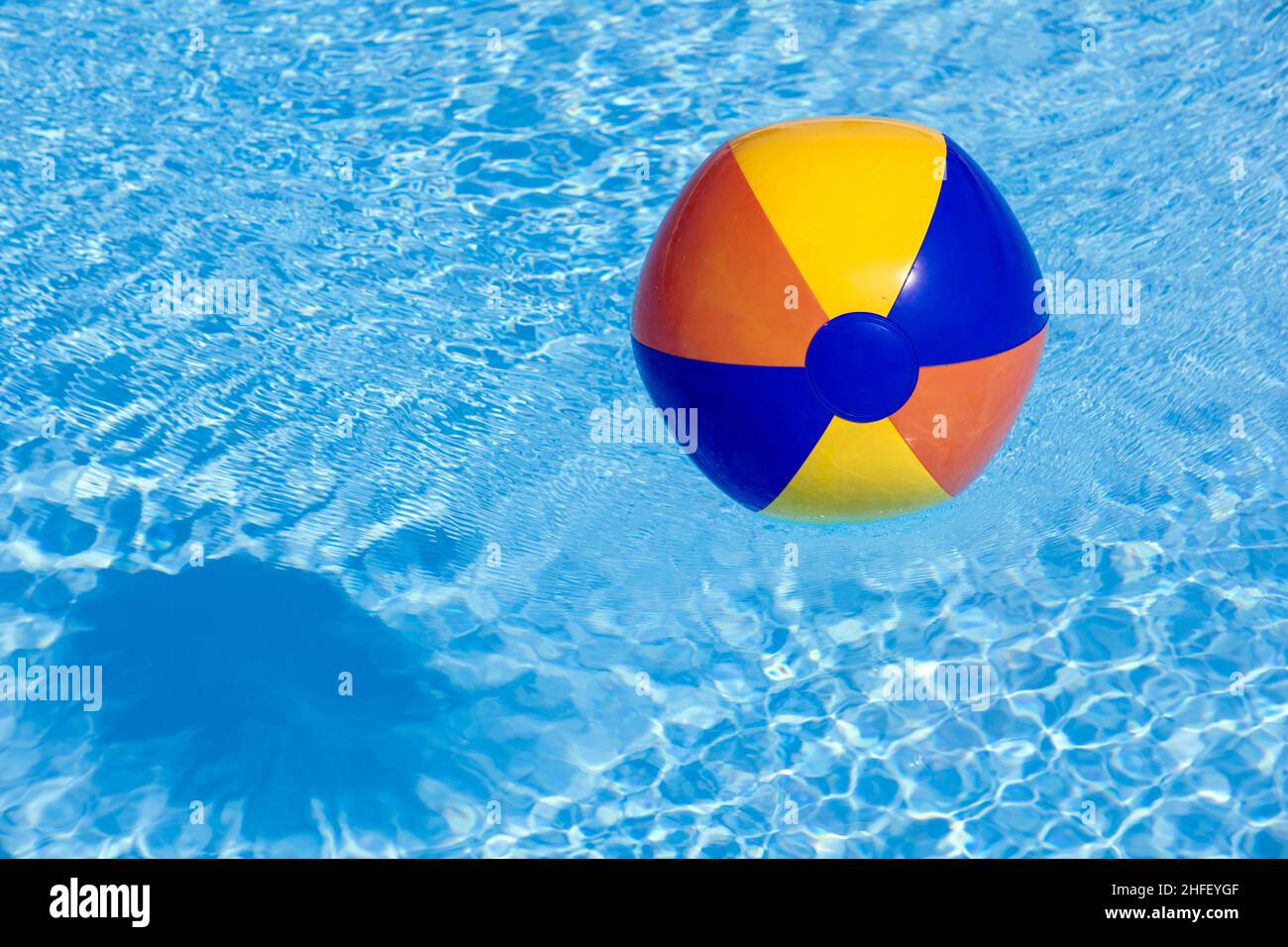 inflated plastic ball flying in the pool Stock Photo - Alamy