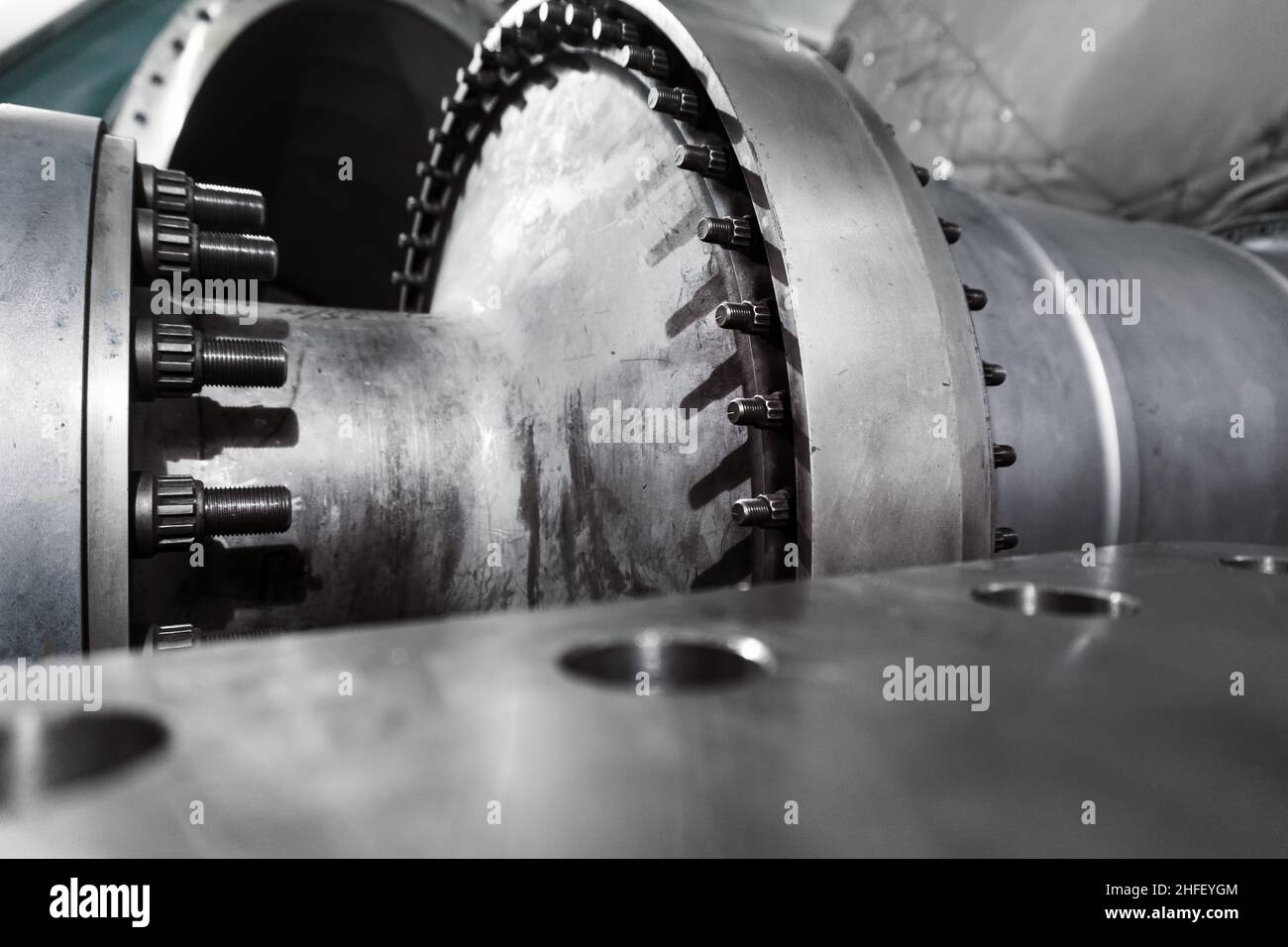 The rotor of a gas turbine compressor with a bolted coupling half ...