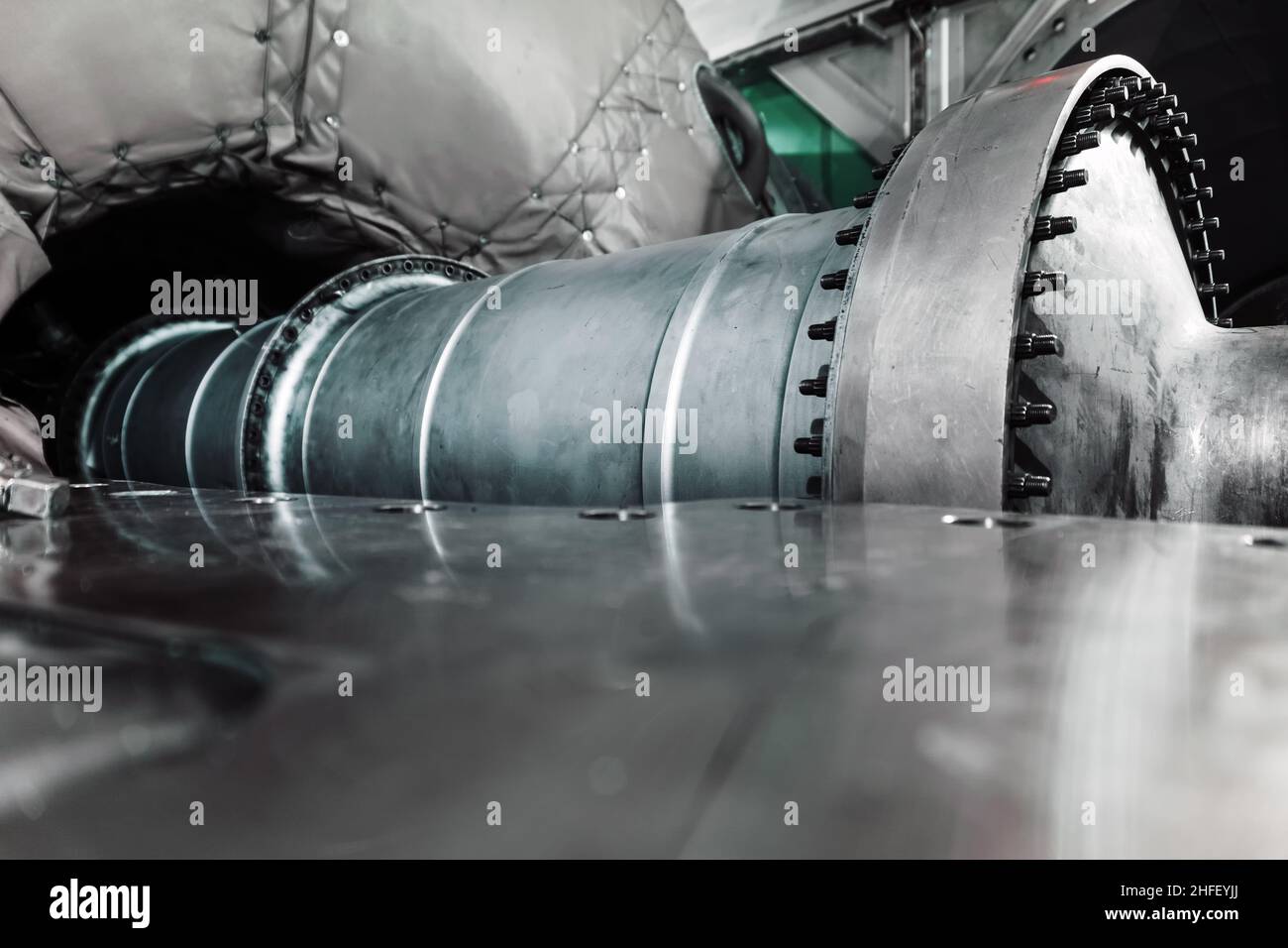 The rotor of a gas turbine compressor with a bolted coupling half ...