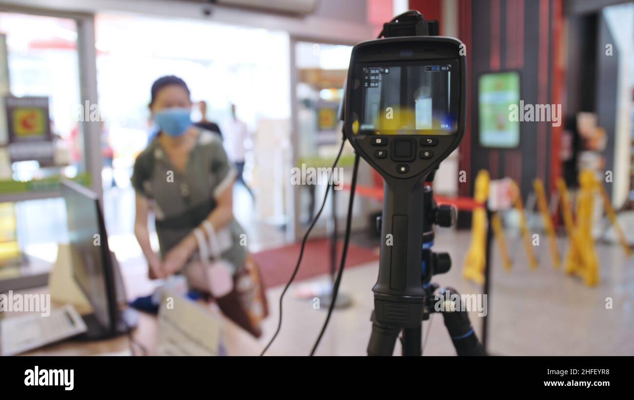Temperature check at a supermarket, grocery store with a thermal ...