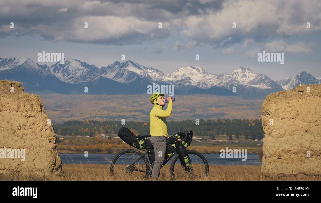 The man travel on mixed terrain cycle touring with bikepacking. The ...