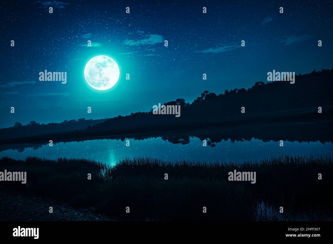 Beautiful landscape of blue sky with many stars and full moon above ...