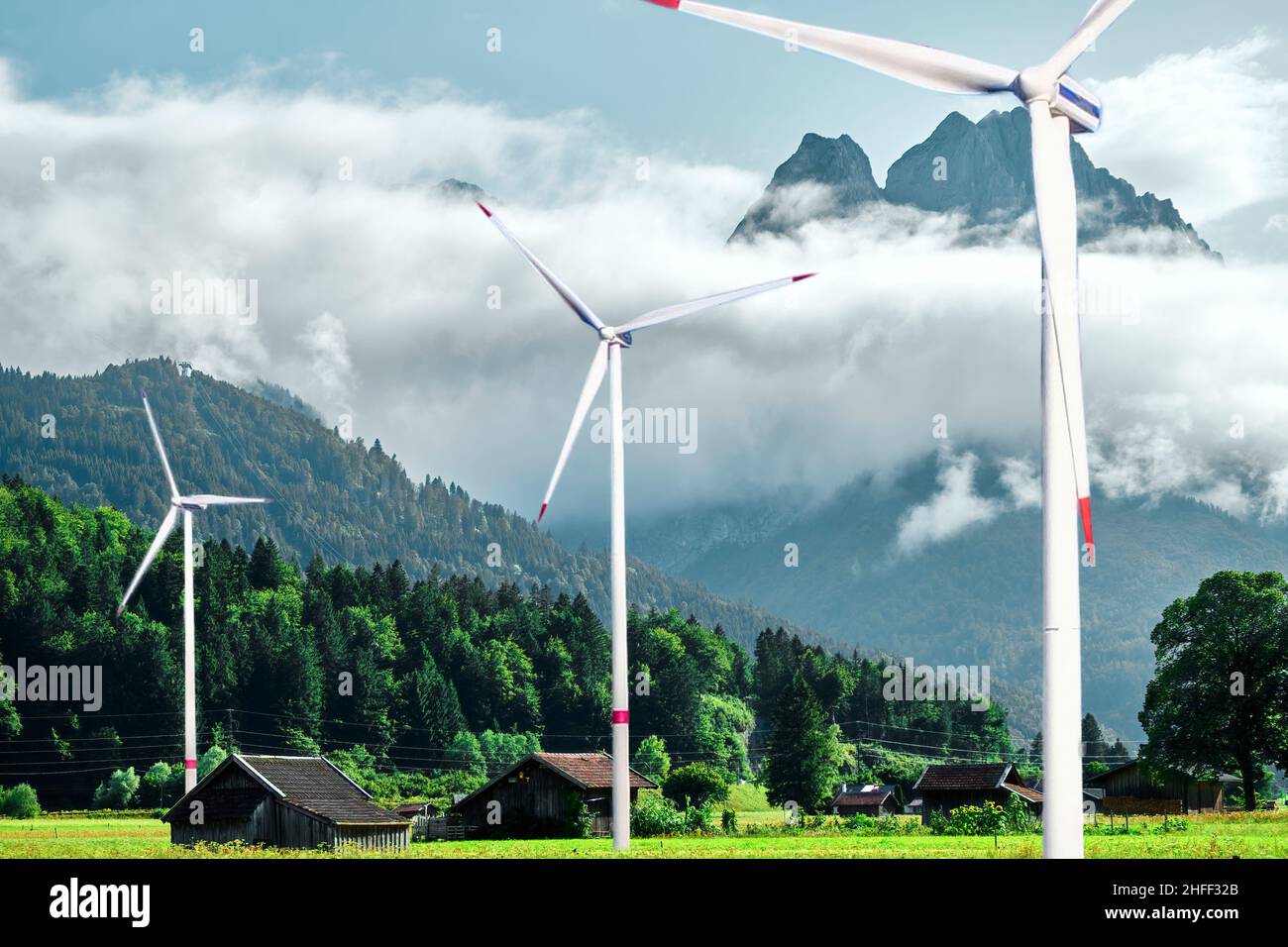Composite, wind turbines for energy generation in front of the massif ...