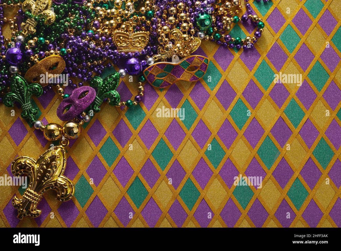 Frame of Mardi Gras Mask and colorful Mardi Gras Beads on diamond ...