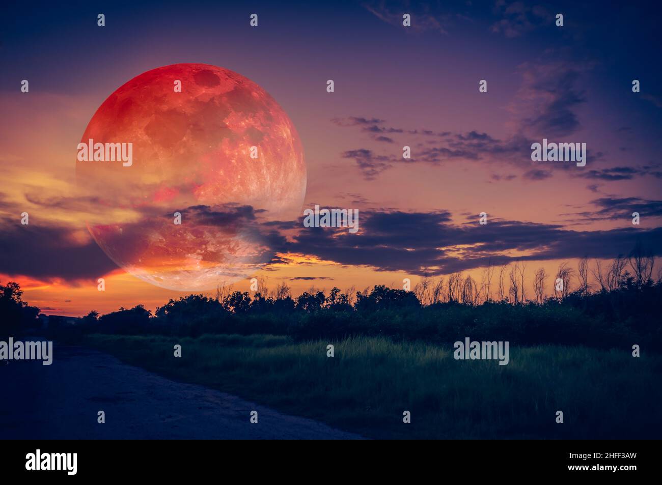 Beautiful countryside area at night. Attractive red super moon or blood ...