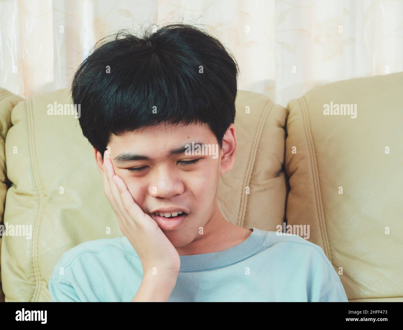 Little asia boy suffer from toothache. He sad with tooth pain, dental ...