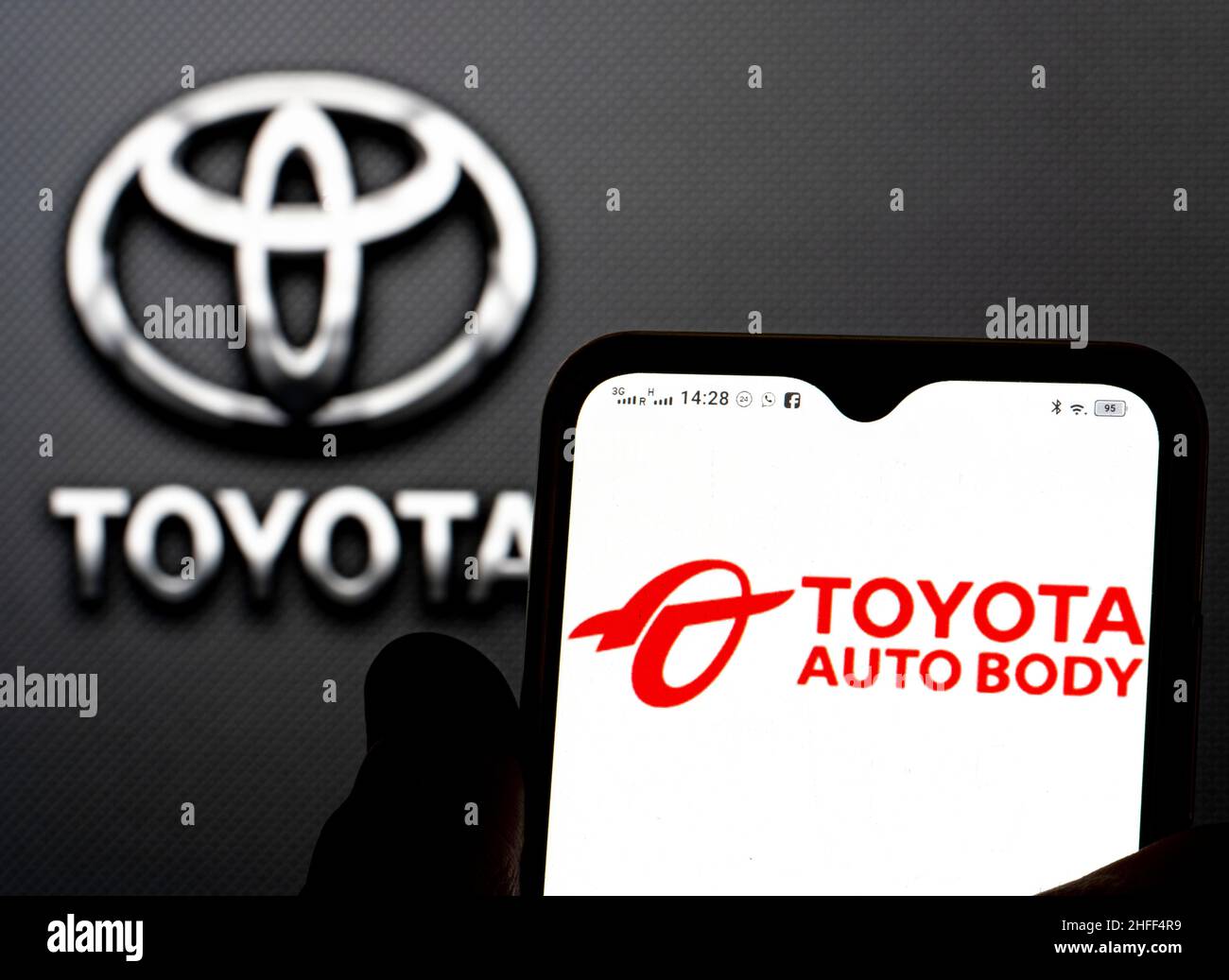 In this photo illustration, the Toyota Auto Body Co., Ltd. logo is seen ...