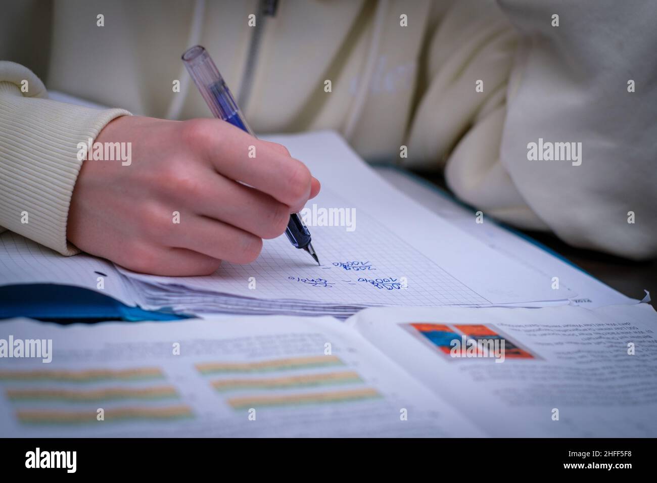 a child does his math homework with a fountain pen Stock Photo - Alamy