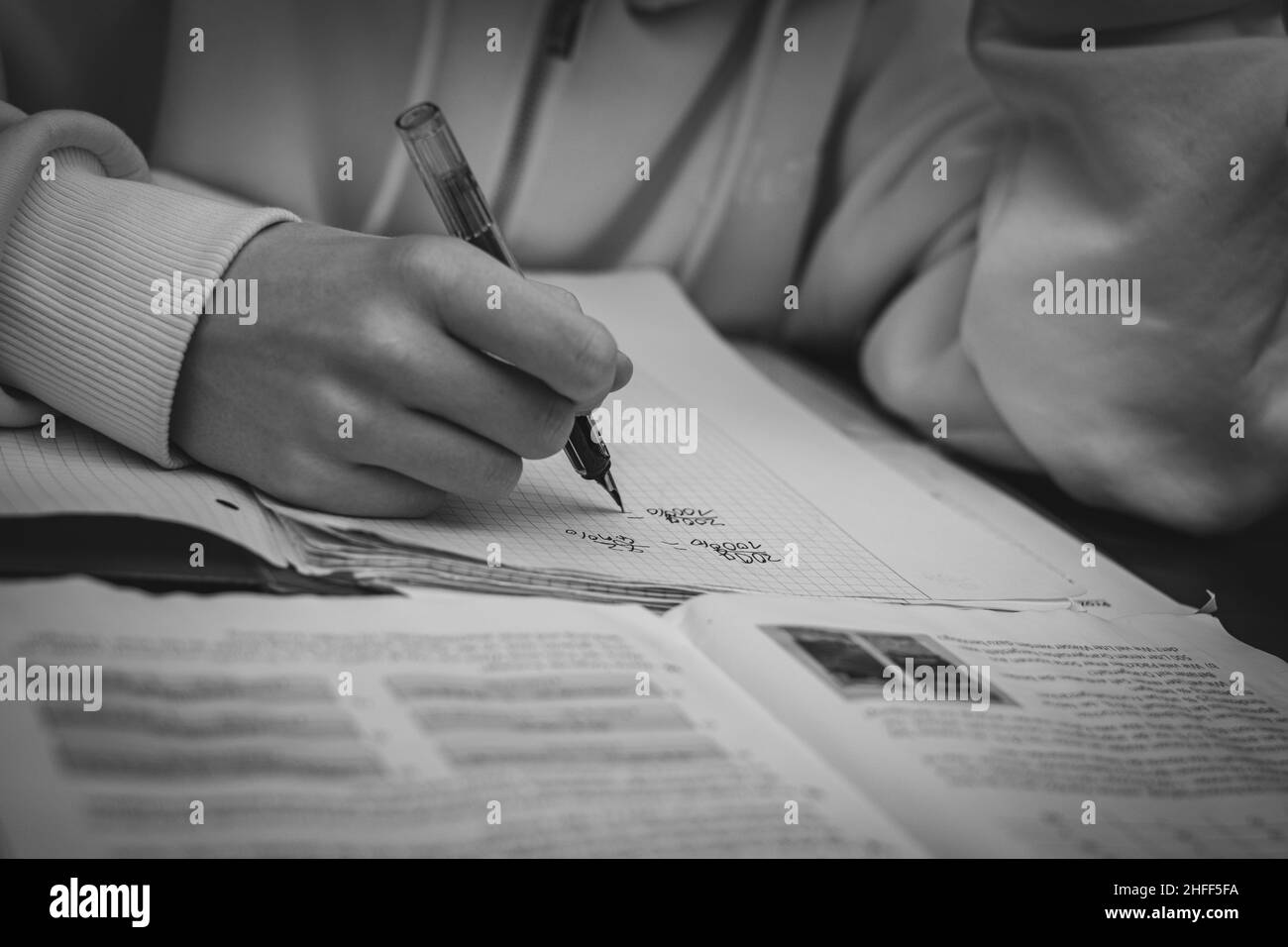 a child does his math homework with a fountain pen Stock Photo - Alamy