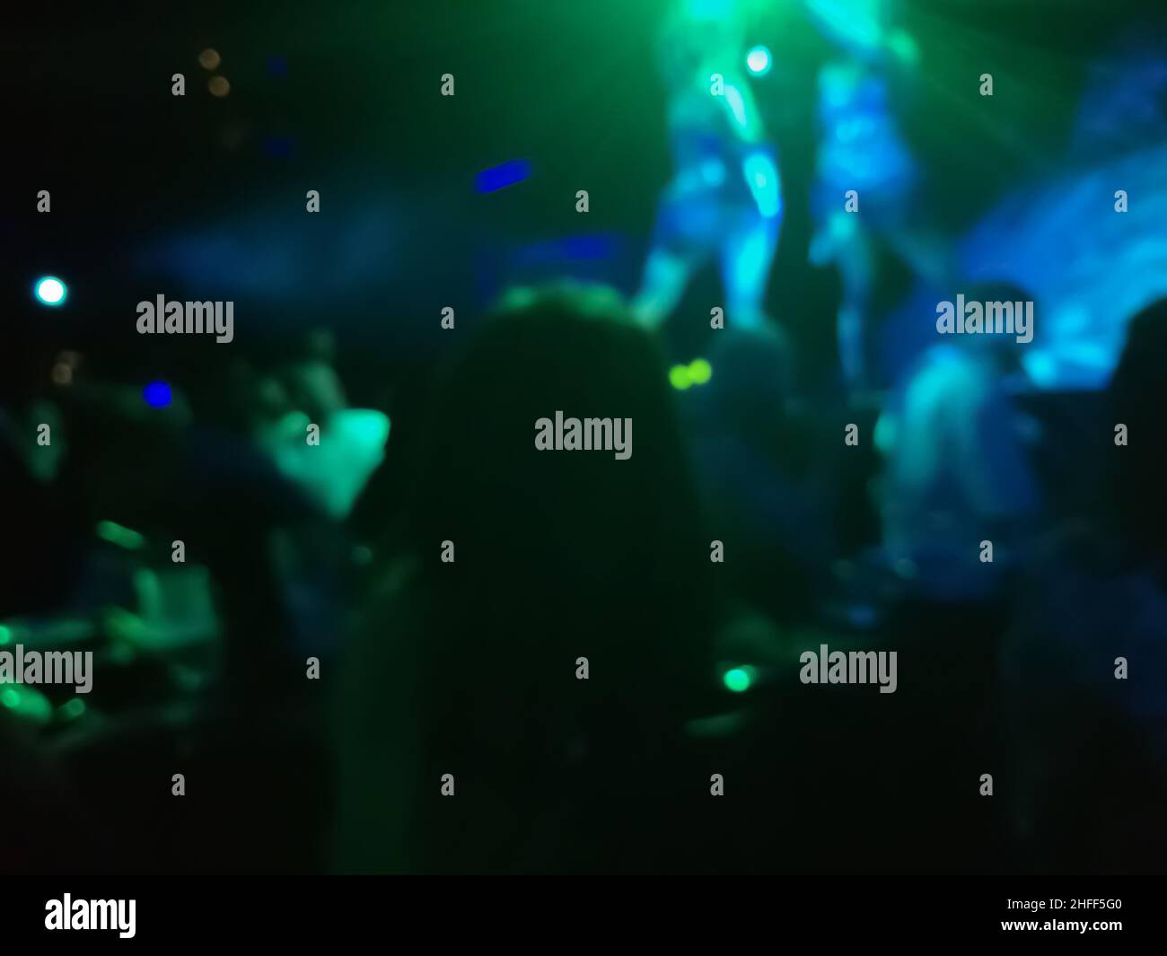 Defocused abstract blurred scene of musical light performance in a ...