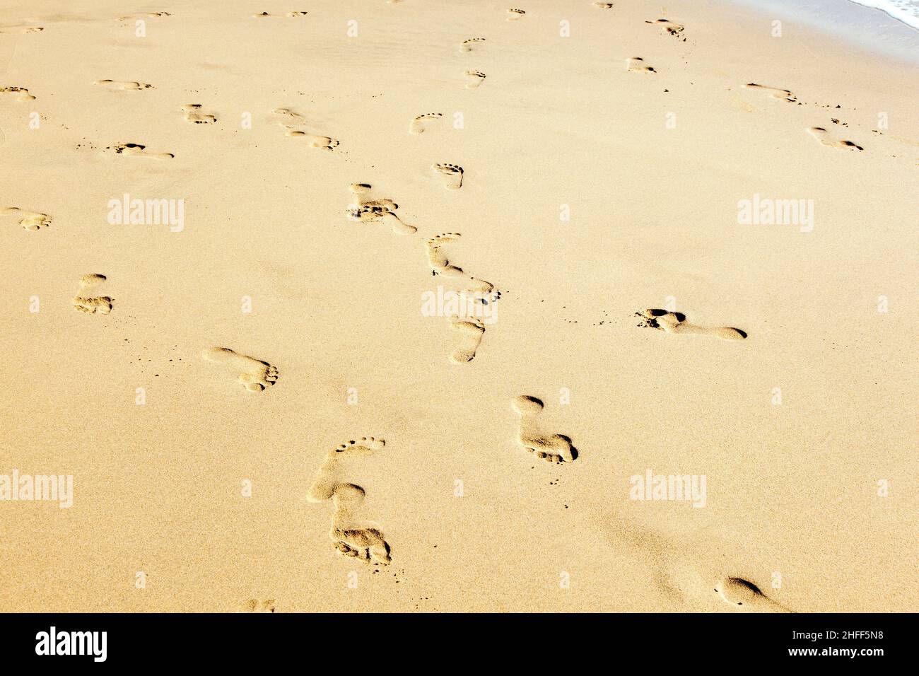 human footsteps at the clean sandy beach Stock Photo - Alamy
