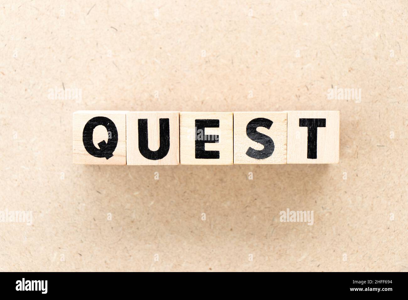 Alphabet letter block in word quest on wood background Stock Photo - Alamy