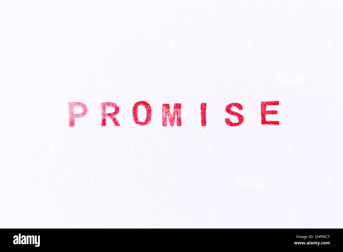 Red color ink rubber stamp in word promise on white paper background ...