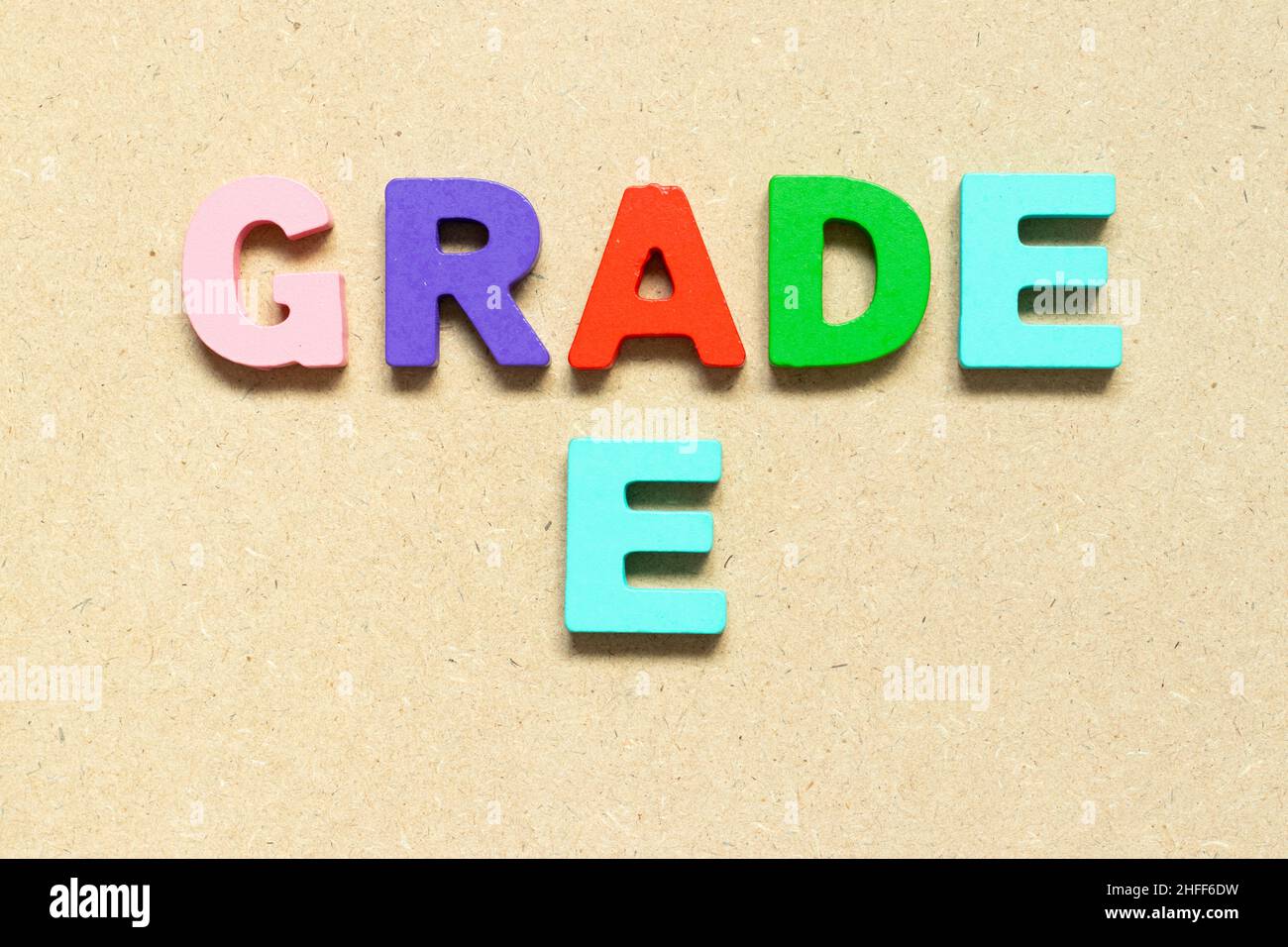 Color alphabet letter with word grade E on wood background Stock Photo ...