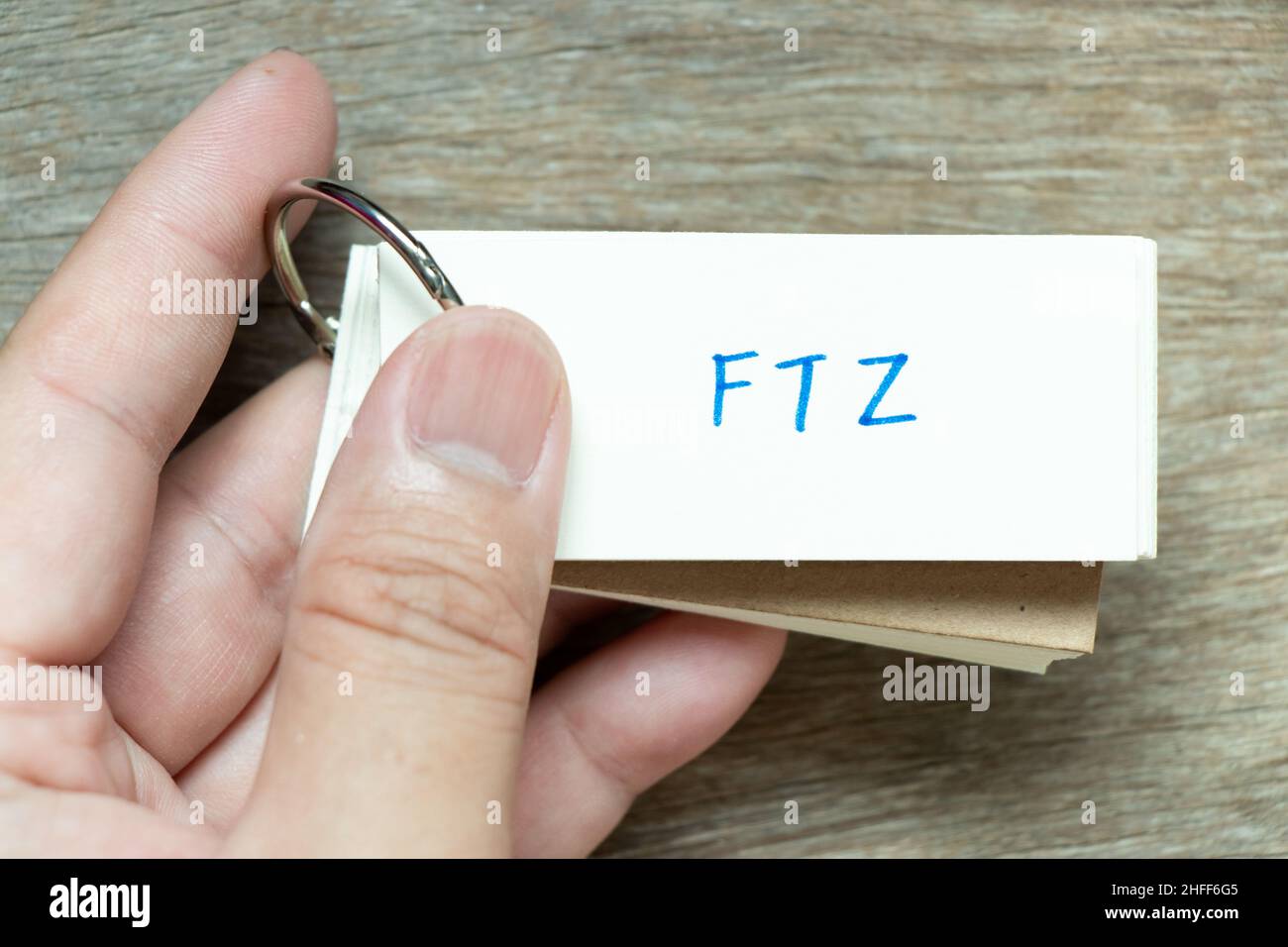 Man hold the flash card with handwriting word FTZ (Abbreviation of Free ...