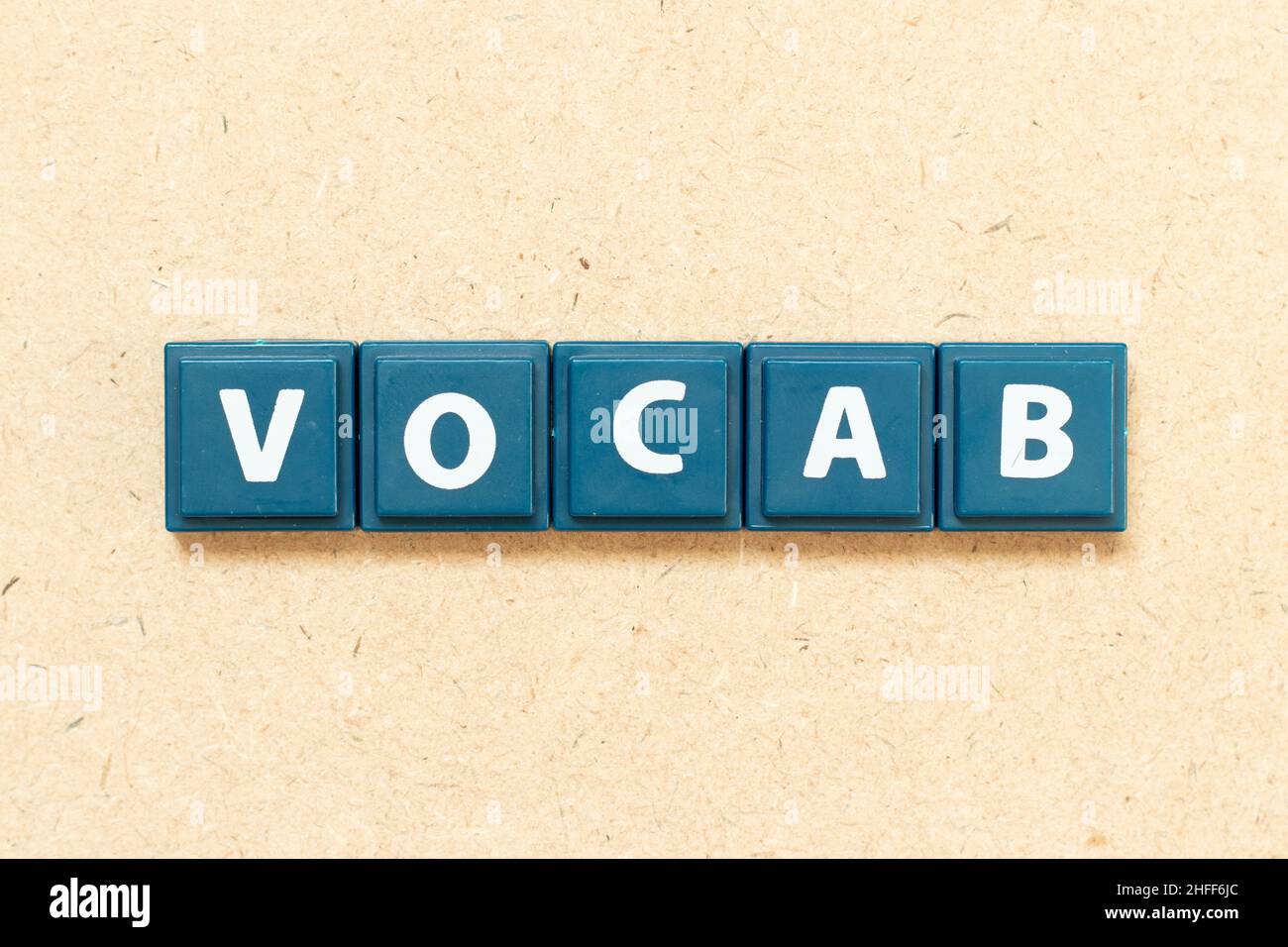 Tile alphabet letter in word vocab on wood background Stock Photo - Alamy