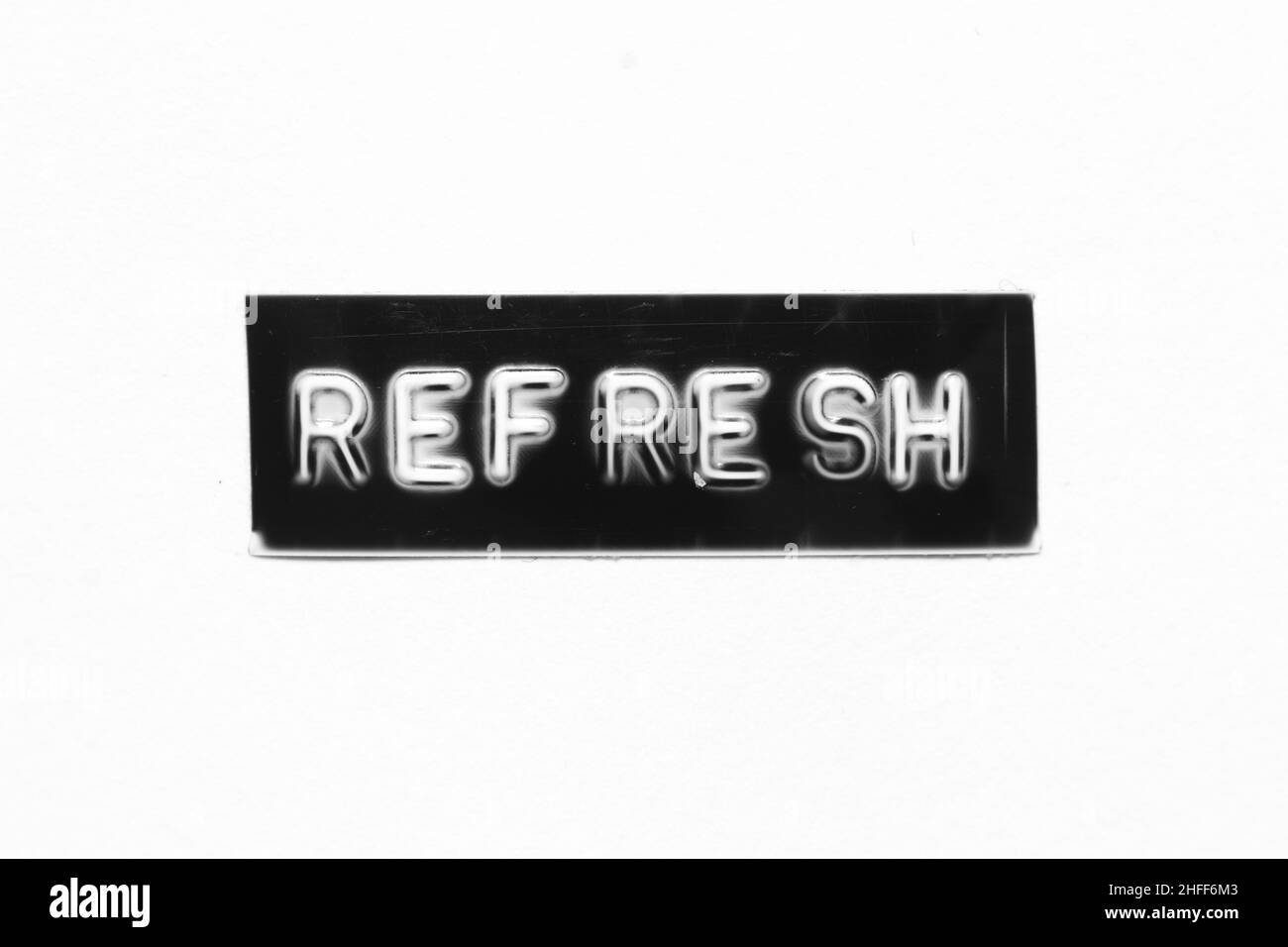 Black color banner that have embossed letter with word refresh on white ...