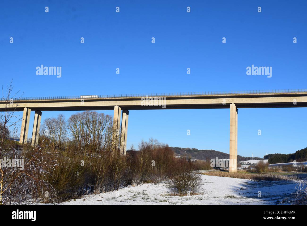 Autobahn bridge of the A1 near Daun and Rengen above snowy landscape ...