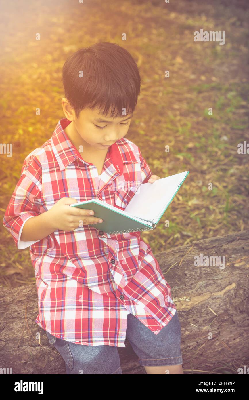 Asian boy reading hi-res stock photography and images - Alamy