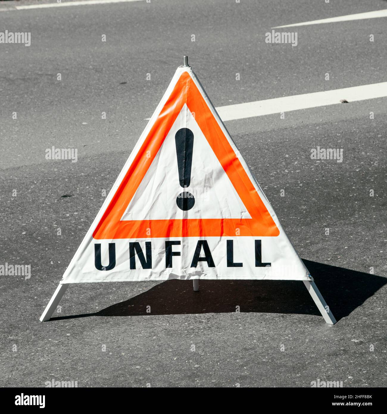 accident warning sign at the street for other cars Stock Photo - Alamy