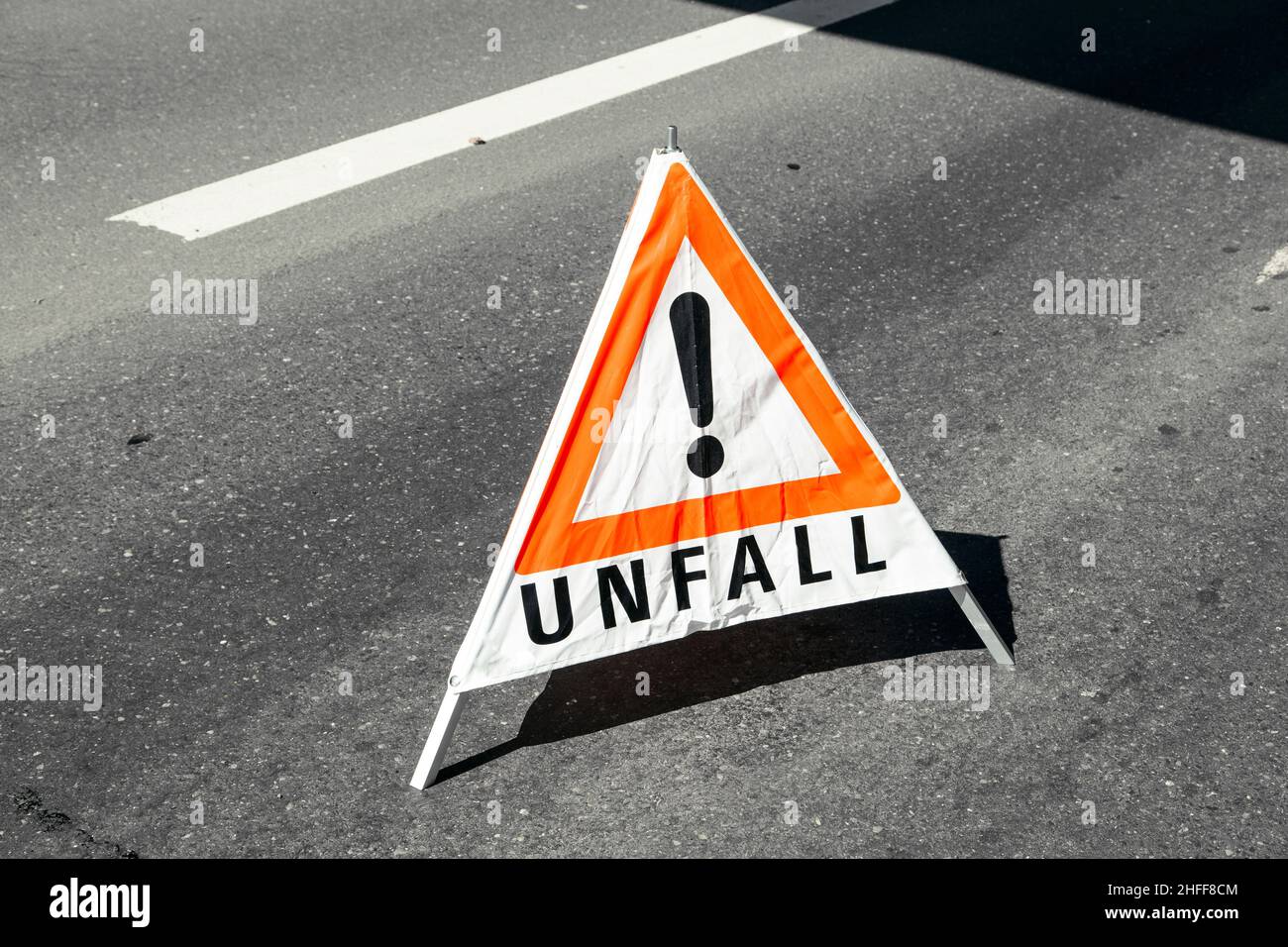 accident warning sign at the street for other cars Stock Photo - Alamy