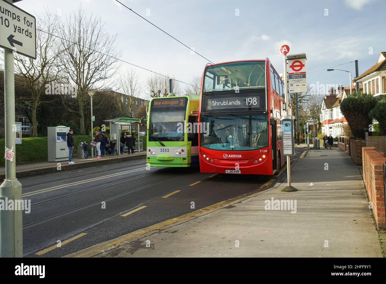 Croydon Tram overtaking Bus -1 Stock Photo - Alamy