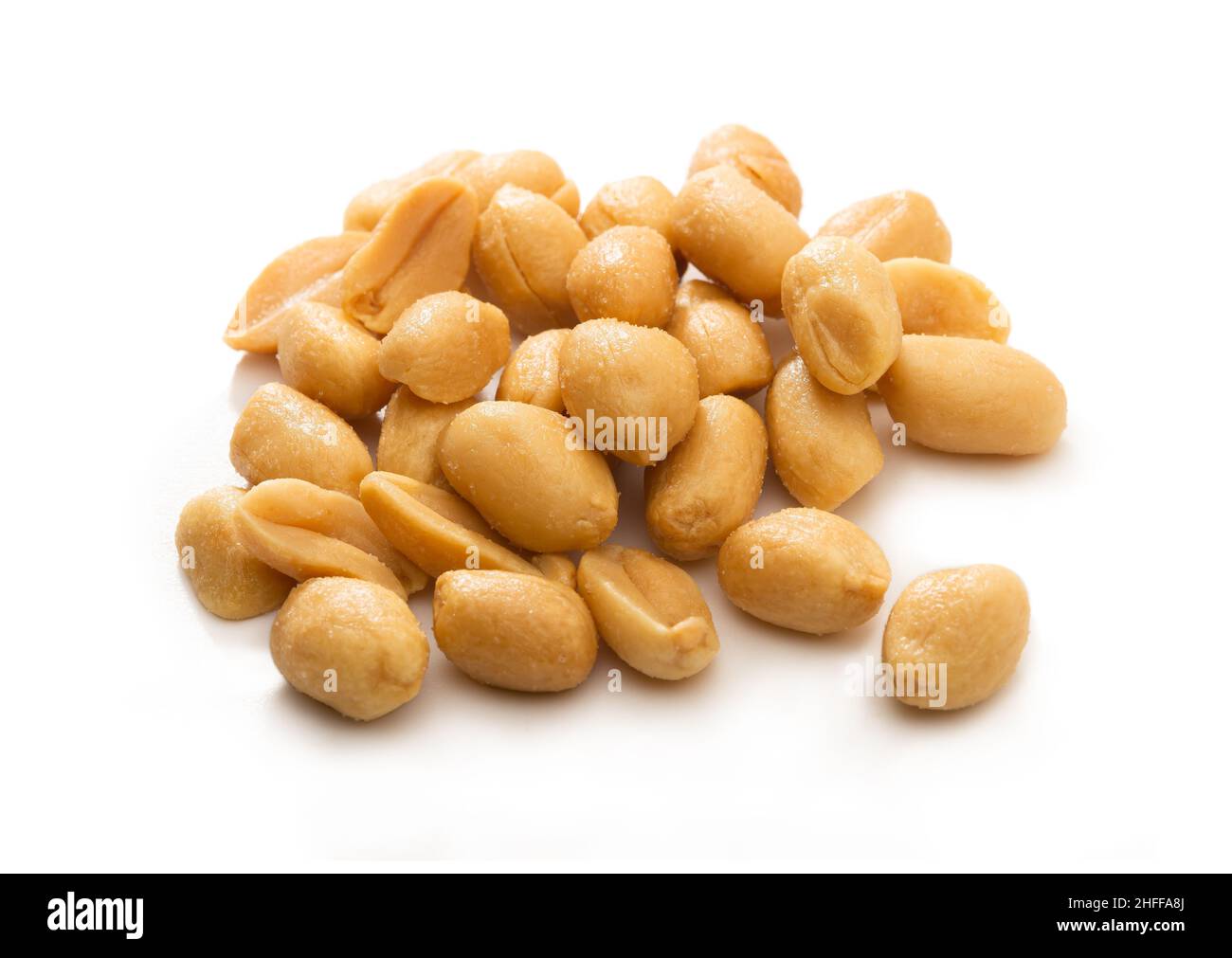 Roasted and salted peanuts isolated against white background Stock ...