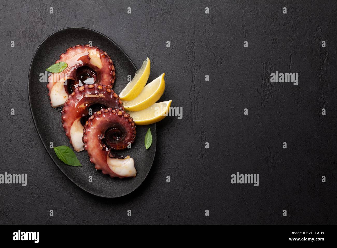 Grilled octopus with lemon. Top view flat lay with copy space Stock ...