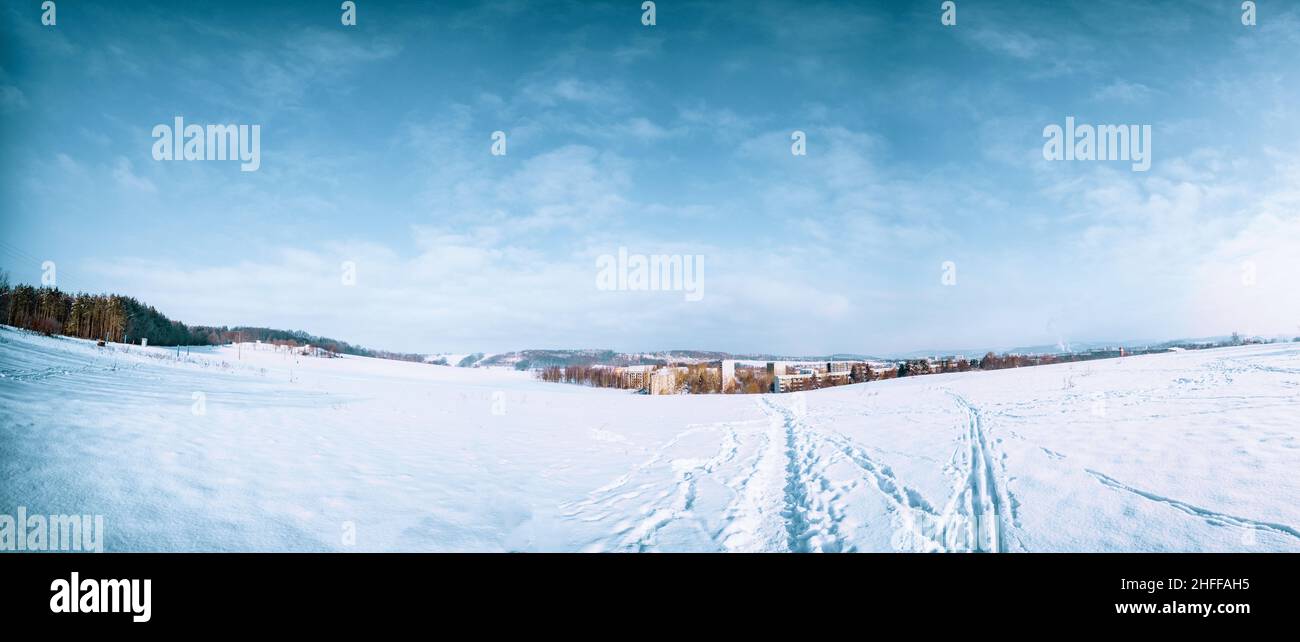 Snowy field with human footprints Stock Photo - Alamy