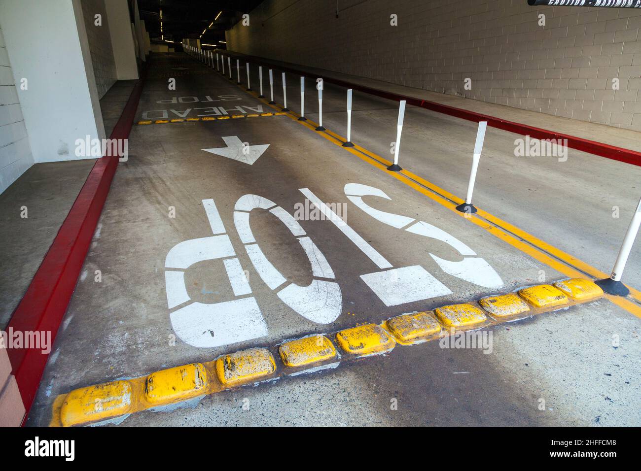 stop sign in a garage painted on the asphalt Stock Photo - Alamy
