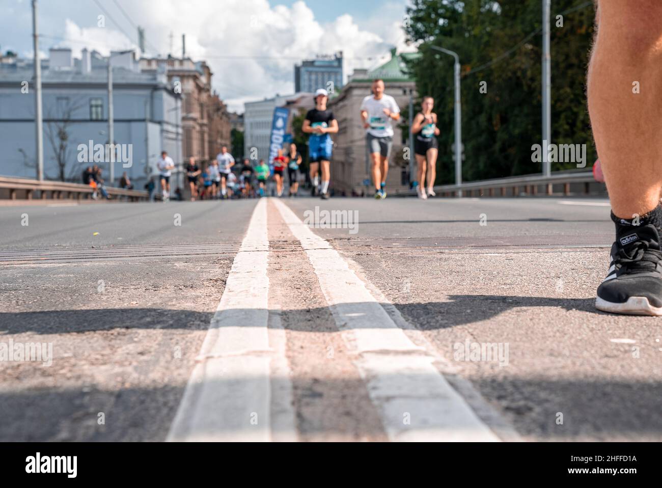 Large group of men runners running marathon Stock Photo - Alamy