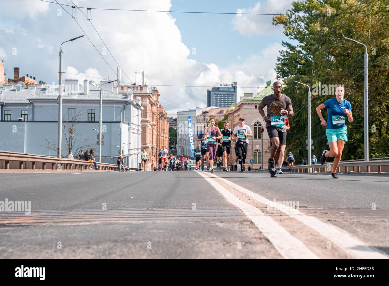 Runners crossing Riga streets during Tet Riga Marathon Stock Photo - Alamy