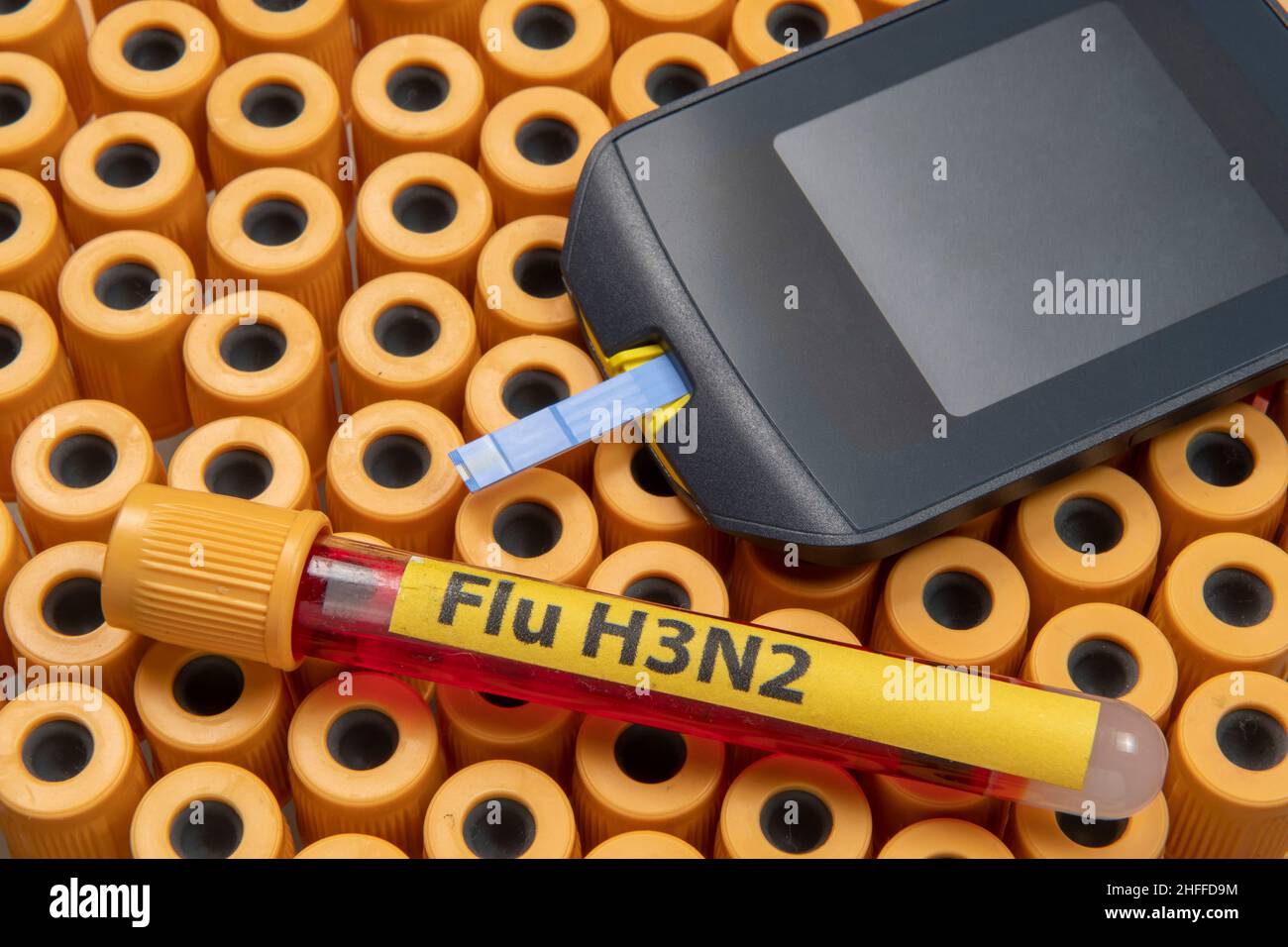 blood collection tubes labeled "Flu H3N2" symbolizing the flu epidemic ...