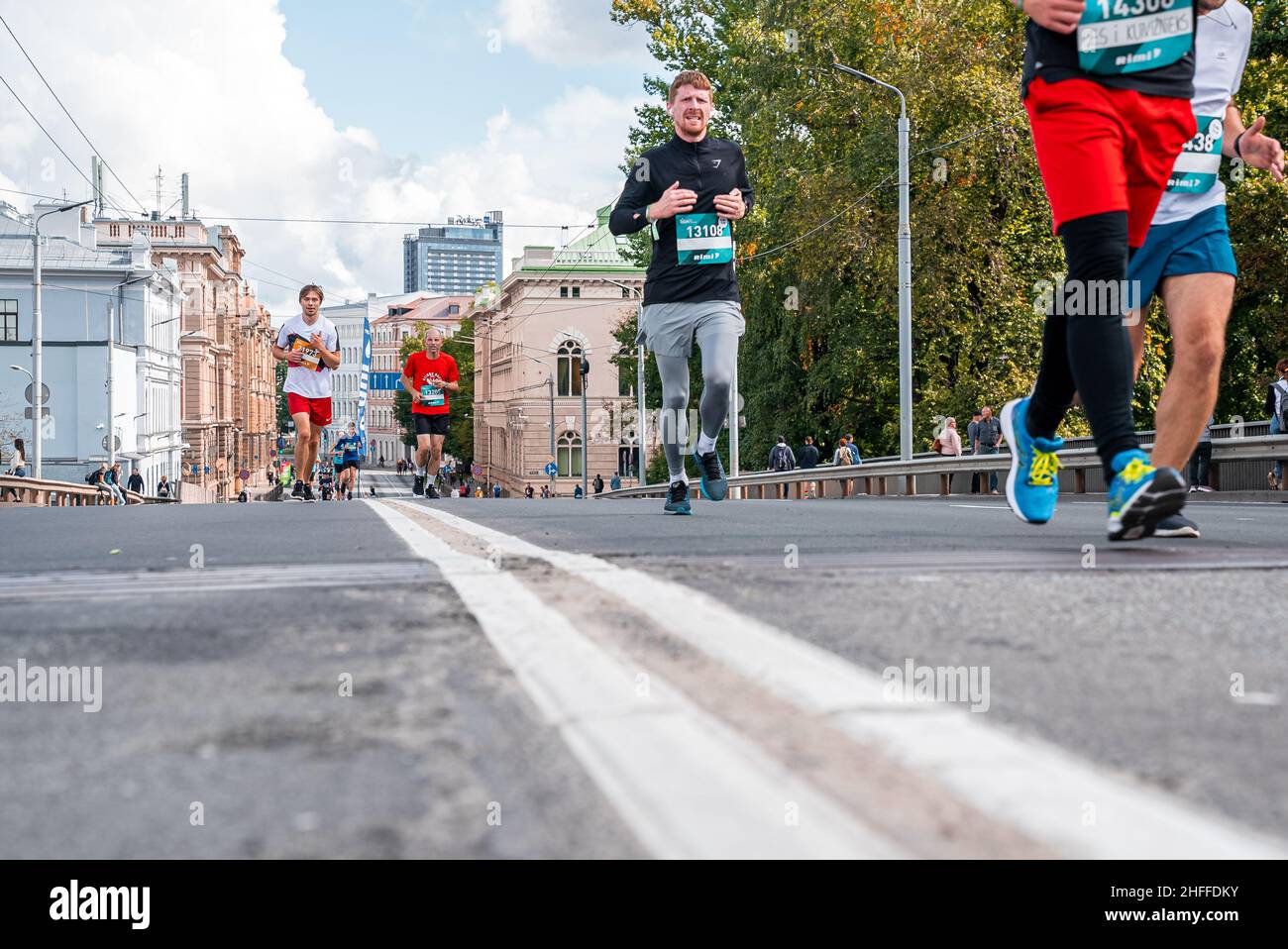 Large group of men runners running marathon Stock Photo - Alamy