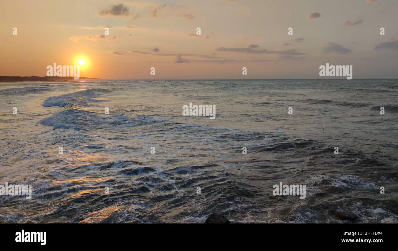 Ocean waves lit sunset hi-res stock photography and images - Alamy