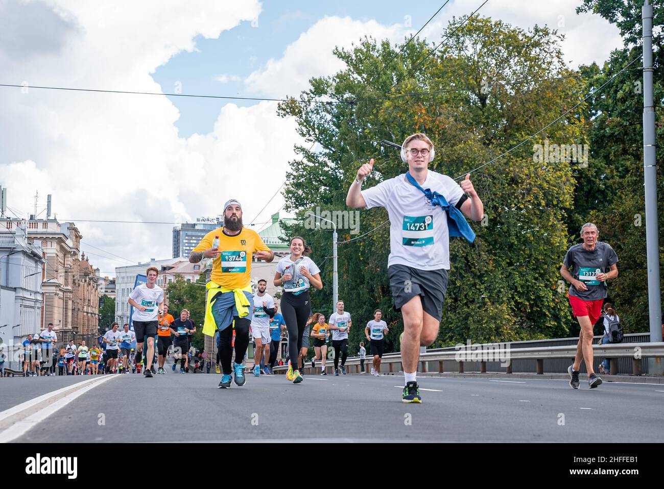 Large group of men runners running marathon Stock Photo - Alamy