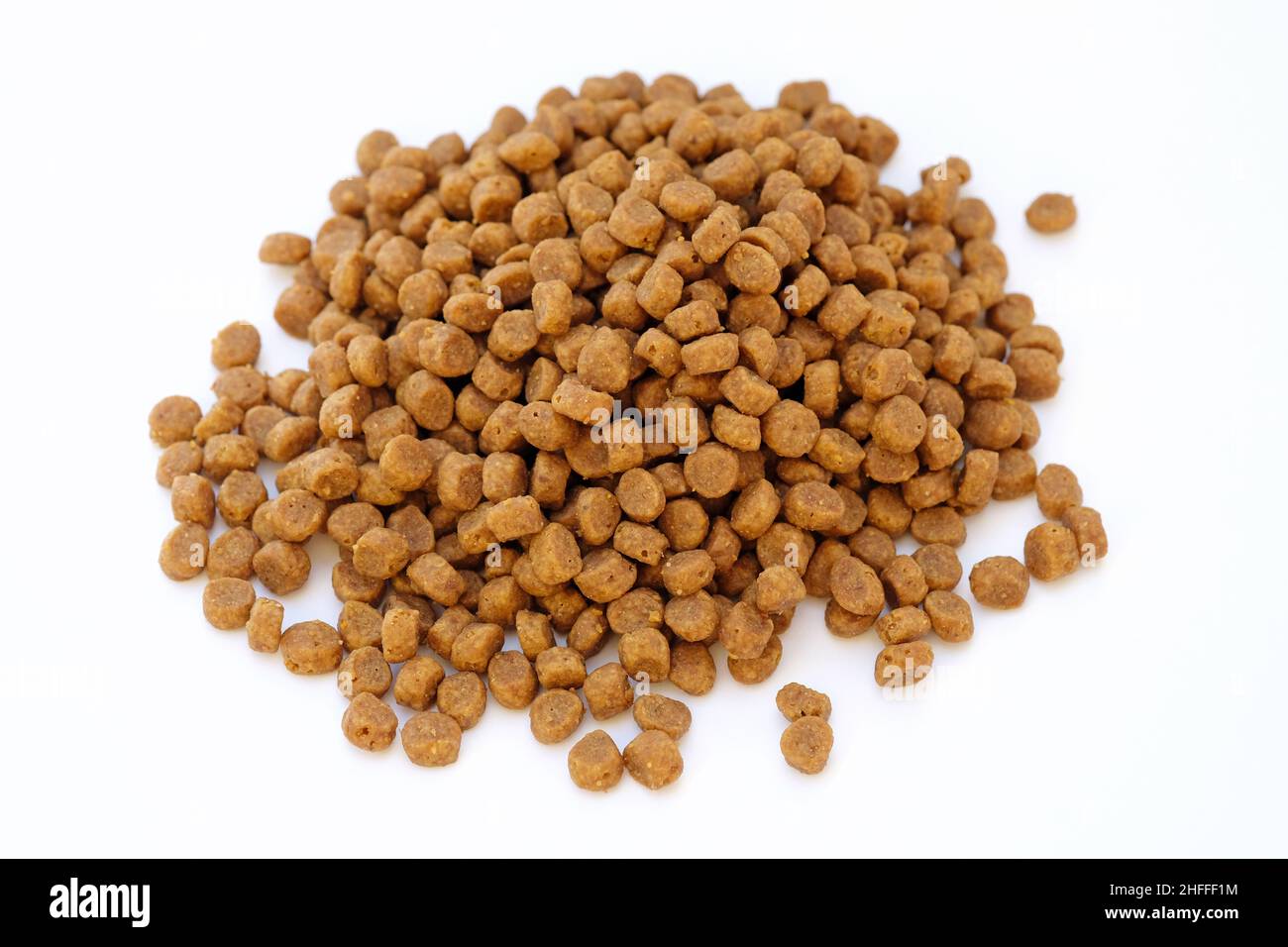 Dry food for cats, small granules on a white background. Animal food ...