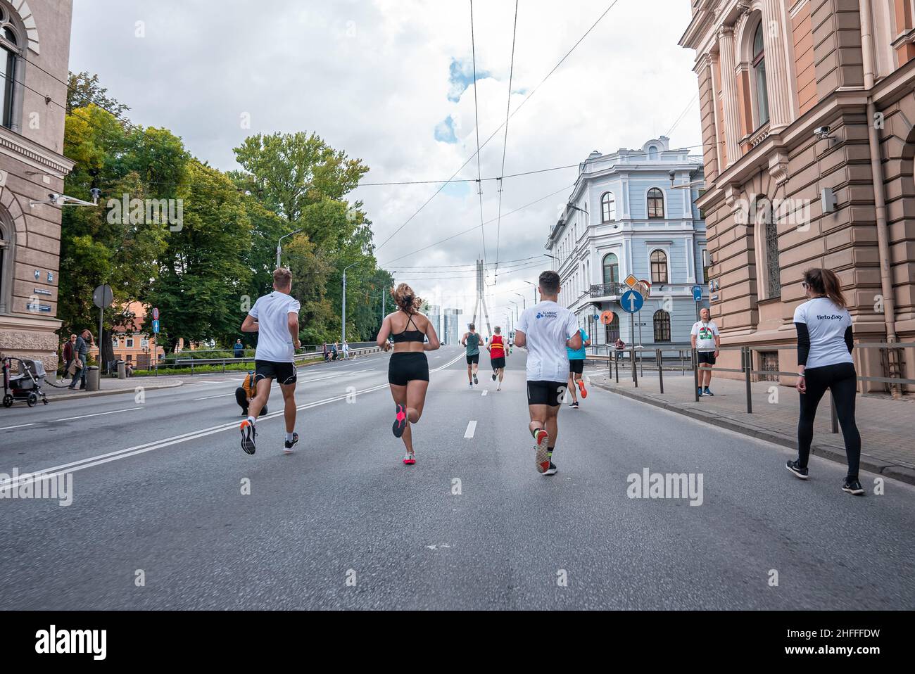 Large group of men runners running marathon Stock Photo - Alamy