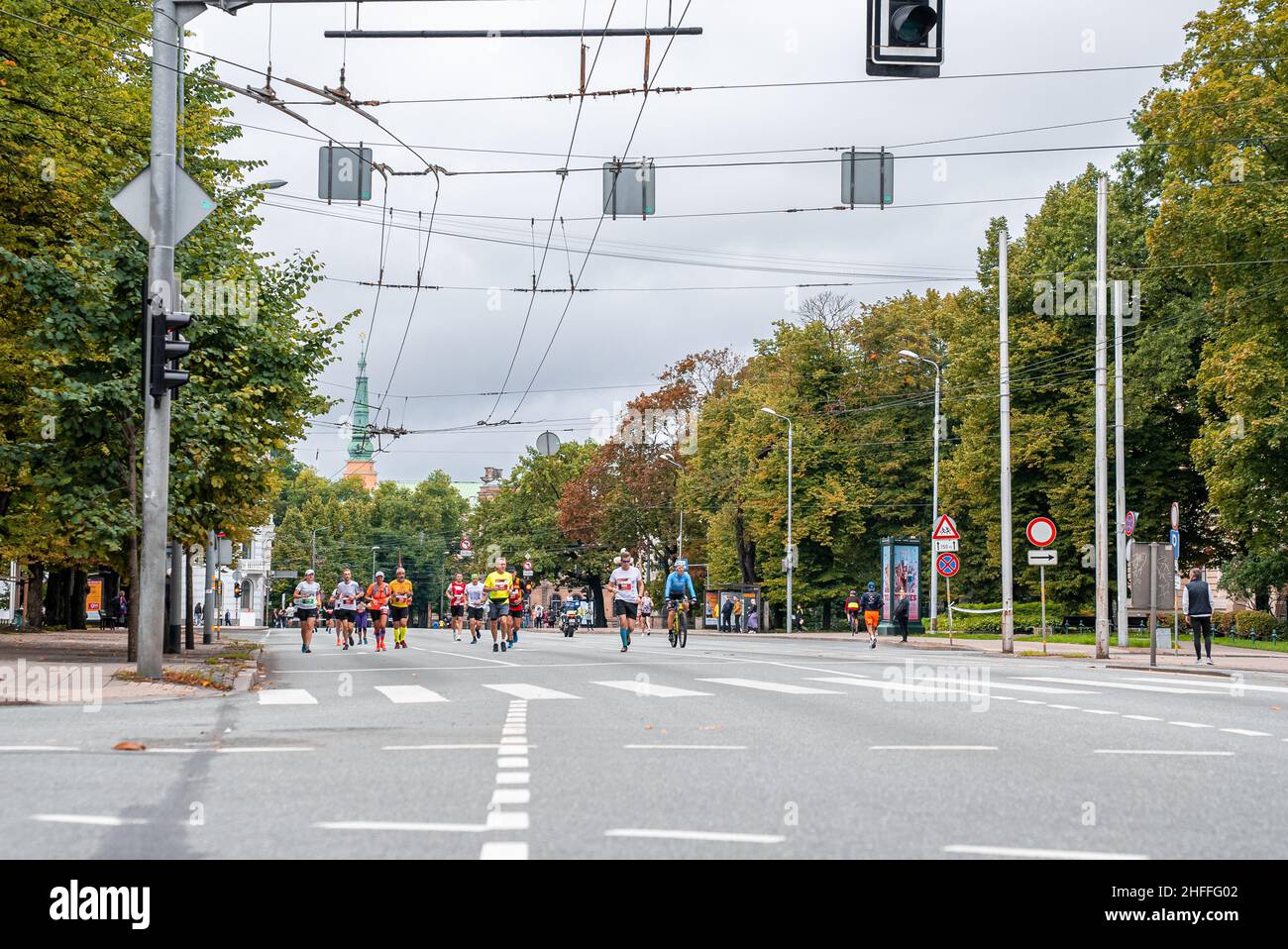 Large group of men runners running marathon Stock Photo - Alamy