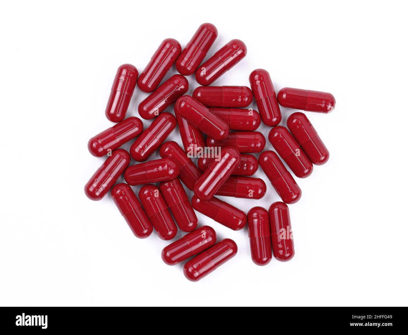 Red capsules on a white background top view. Capsules for good liver ...