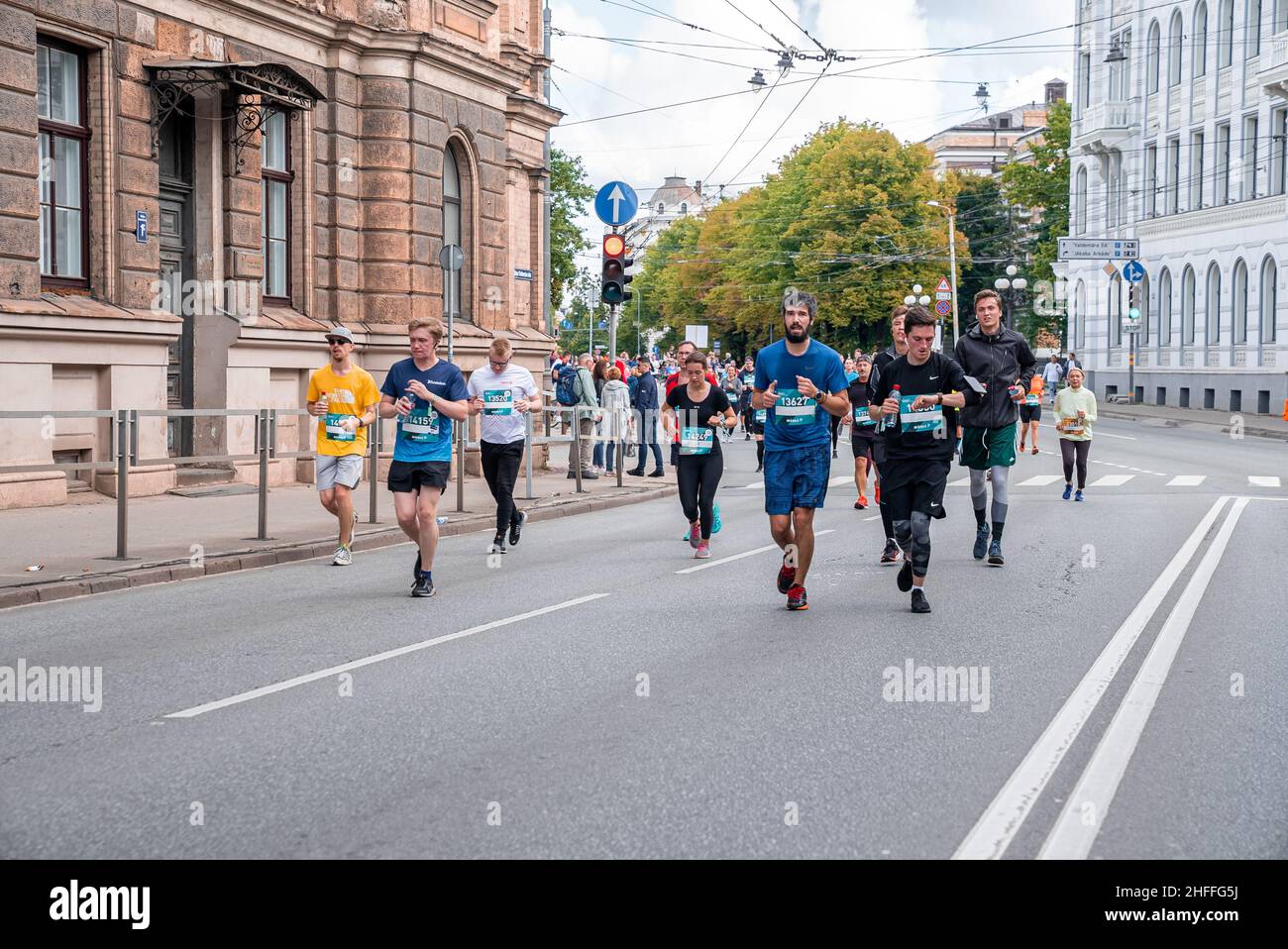 Large group of men runners running marathon Stock Photo - Alamy