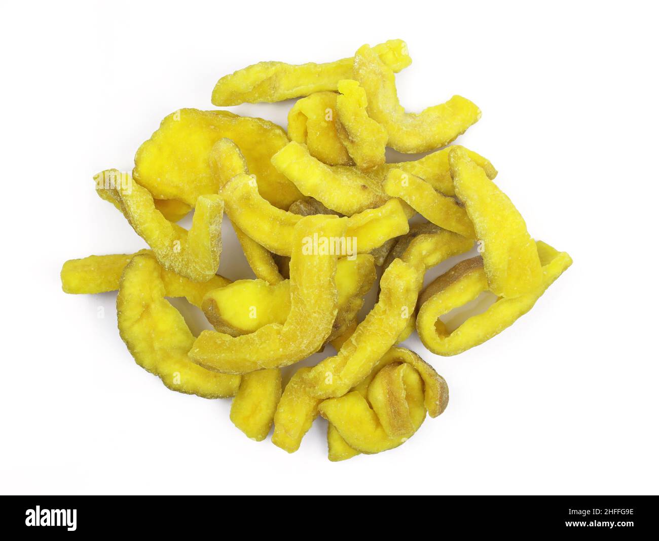 Dried guava on a white plate. Dried fruits top view. Dried yellow guava ...