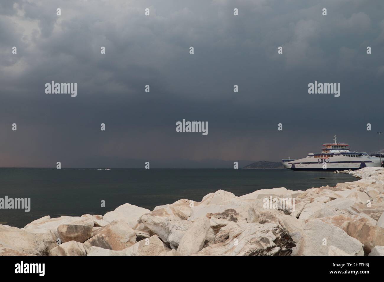 Ferry boat docked in the harbor on a stormy evening Stock Photo - Alamy