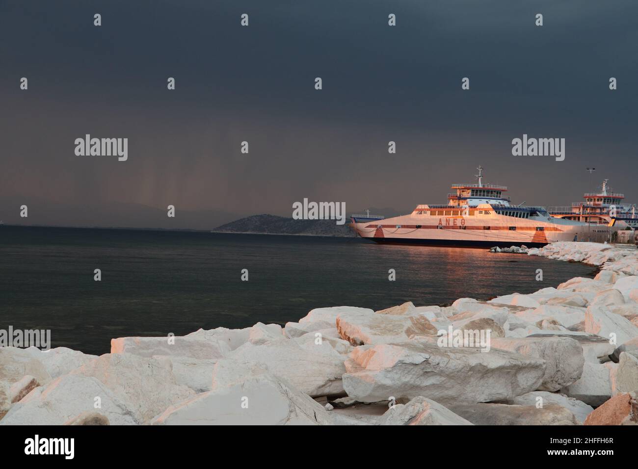 Ferry boat docked in the harbor on a stormy evening Stock Photo - Alamy